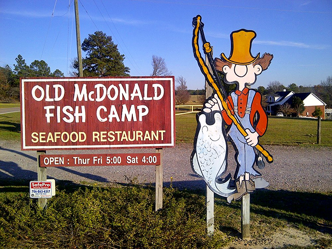 The sign says "Fish Camp" but the experience says "Welcome home." Even the cartoon fisherman looks happy to see you.