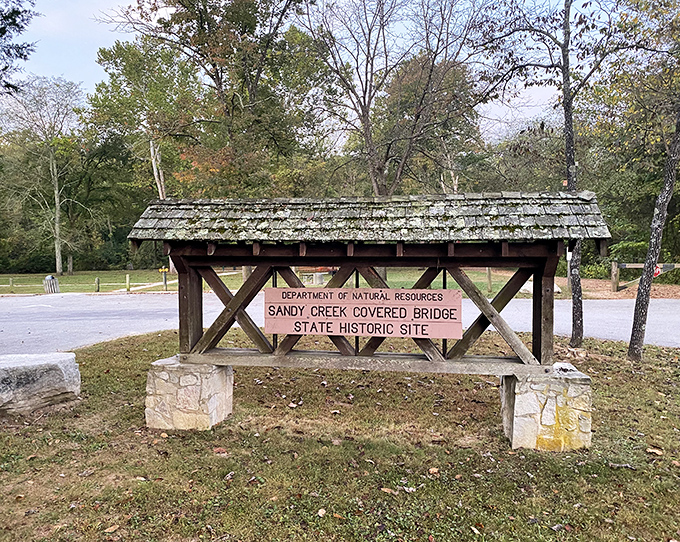 This miniature covered bridge sign proves that even the directions to historic landmarks can be historic landmarks themselves.