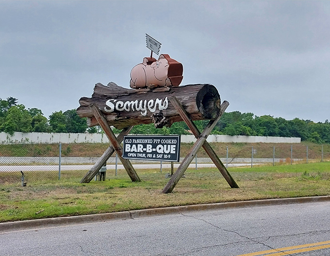 The roadside pig signals your arrival at barbecue nirvana—like a smoky lighthouse guiding hungry travelers to safe harbor.