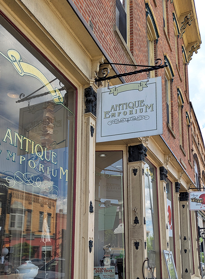 The elegant signage hanging outside promises exactly what's inside: a proper emporium where antiques aren't just sold, they're celebrated.