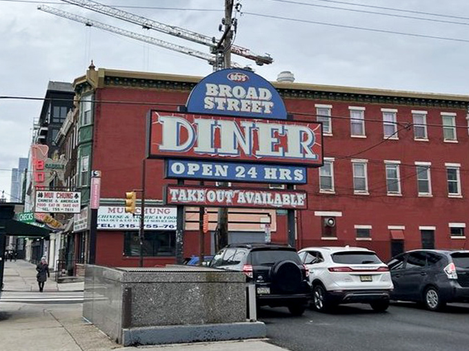 The street-side marquee announces "OPEN 24 HRS" – three beautiful words that have saved many a night owl and early bird alike.