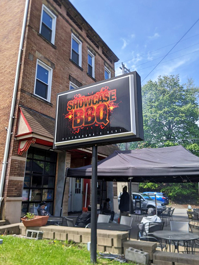 The sign beckons like a barbecue lighthouse, guiding hungry souls to smoky salvation. Some follow stars; the wise follow neon BBQ signs.