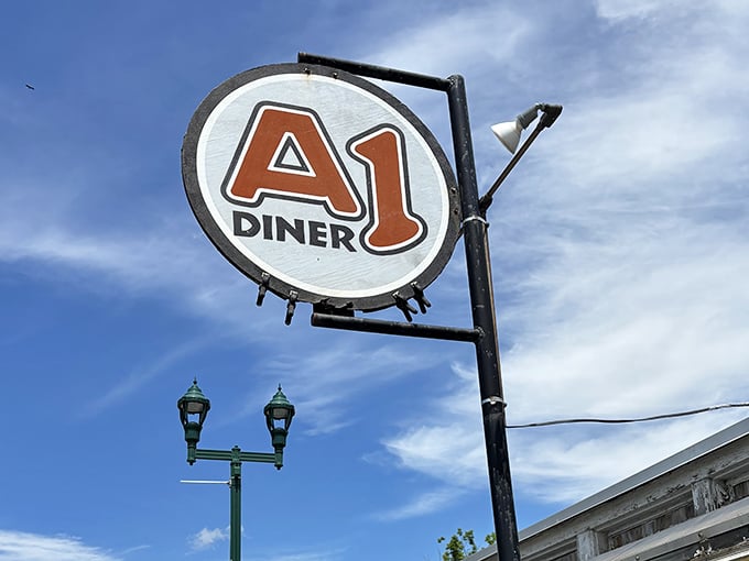 The iconic A1 sign against Maine's blue sky &ndash; a beacon for hungry travelers and locals alike, promising honest food with no pretension.