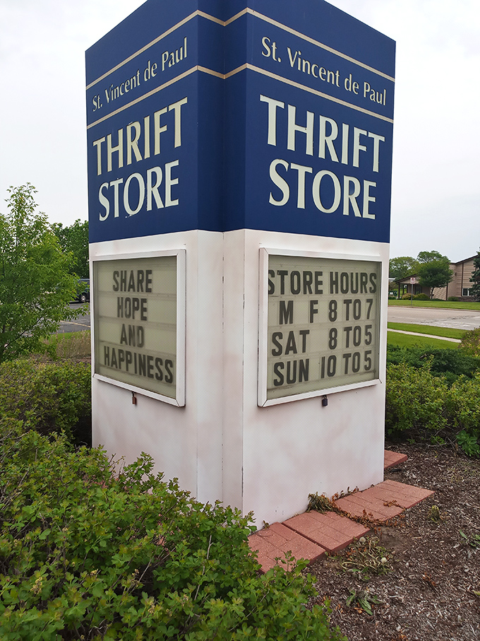 "Share hope and happiness" indeed. The blue and white sign announces store hours while perfectly summarizing the St. Vincent de Paul mission.