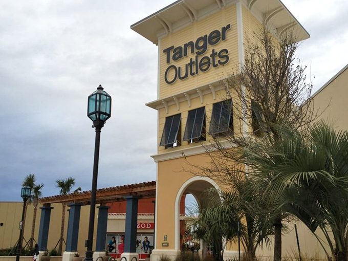 Evening signage proves this shopping paradise looks equally tempting under Texas twilight skies.