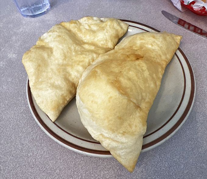 Sopapillas puffed up with pride, knowing they're about to make someone's day significantly better with their honey-drizzled goodness.