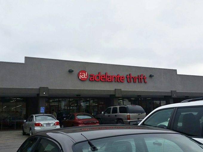 The exterior view on a cloudy day proves treasure hunting happens rain or shine. Adelante Thrift stands ready to welcome bargain seekers regardless of weather. 