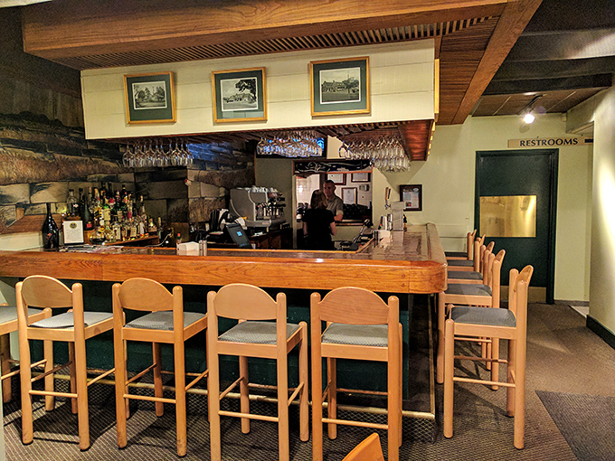 The bar's wooden embrace offers front-row seats to the liquid artistry happening behind the counter—where every pour tells a story.