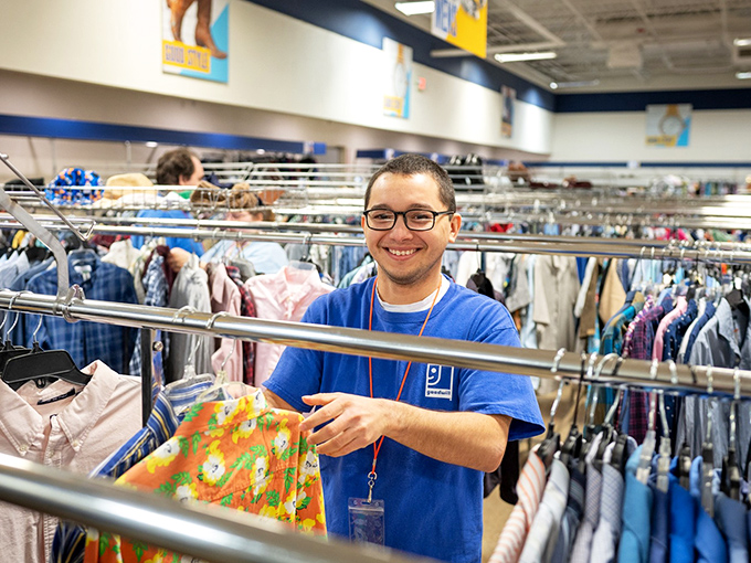 The friendly face of Goodwill &ndash; where staff members don't just stock shelves, they help connect communities with affordable goods while supporting the organization's mission of empowerment.