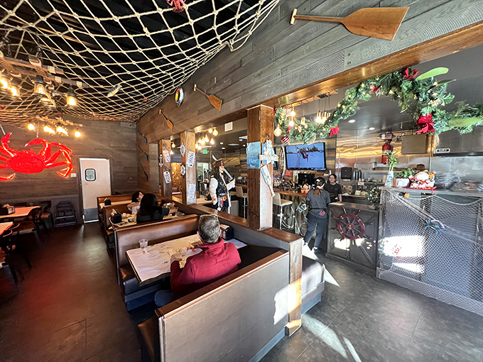 Fishing nets overhead and wooden accents throughout create an atmosphere that's both cozy and reminiscent of a dockside eatery.