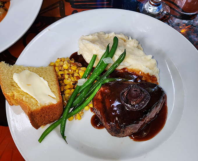 A steak so perfectly glazed it looks like it's been painted by a Renaissance master who decided food was more interesting than frescoes.