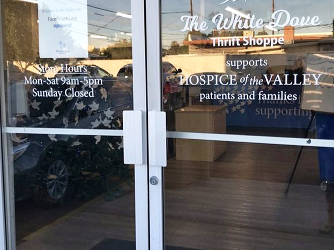 The mission behind the bargains. This entrance sign reminds shoppers that their thrifting adventures support Hospice of the Valley's compassionate care throughout Phoenix.