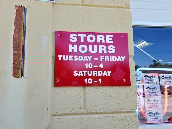 The store hours sign—the treasure hunter's most crucial information. Tuesday through Saturday, these doors open to possibility, bargains, and the thrill of the unexpected find.