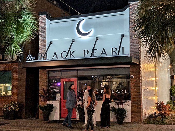 As night falls, The Black Pearl glows like a beacon for those seeking refuge from ordinary dining experiences.