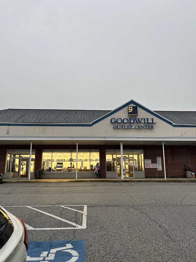 As dusk falls, the Goodwill Outlet transforms from mere store to beacon of bargain possibility for tomorrow's treasure hunters. 