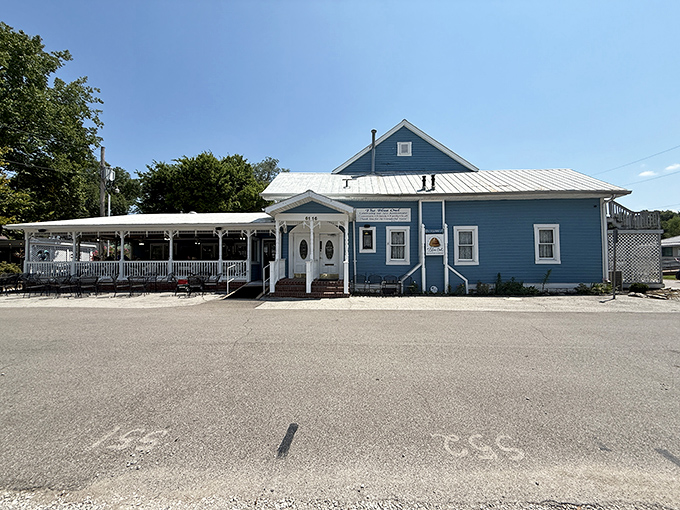 The full view of The Blue Owl reveals its true character—a humble blue building that houses extraordinary culinary treasures. Don't judge this book by its cover.