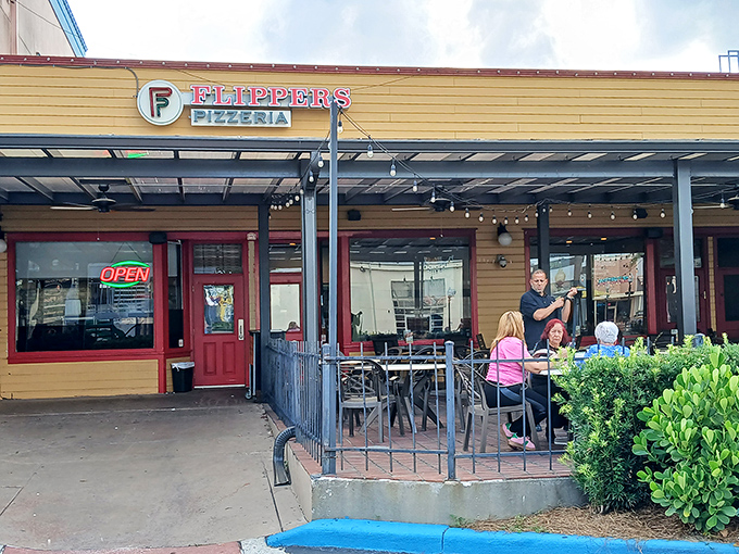 From the outside, it's an unassuming storefront. But locals know this yellow building houses pizza worth driving across town for.