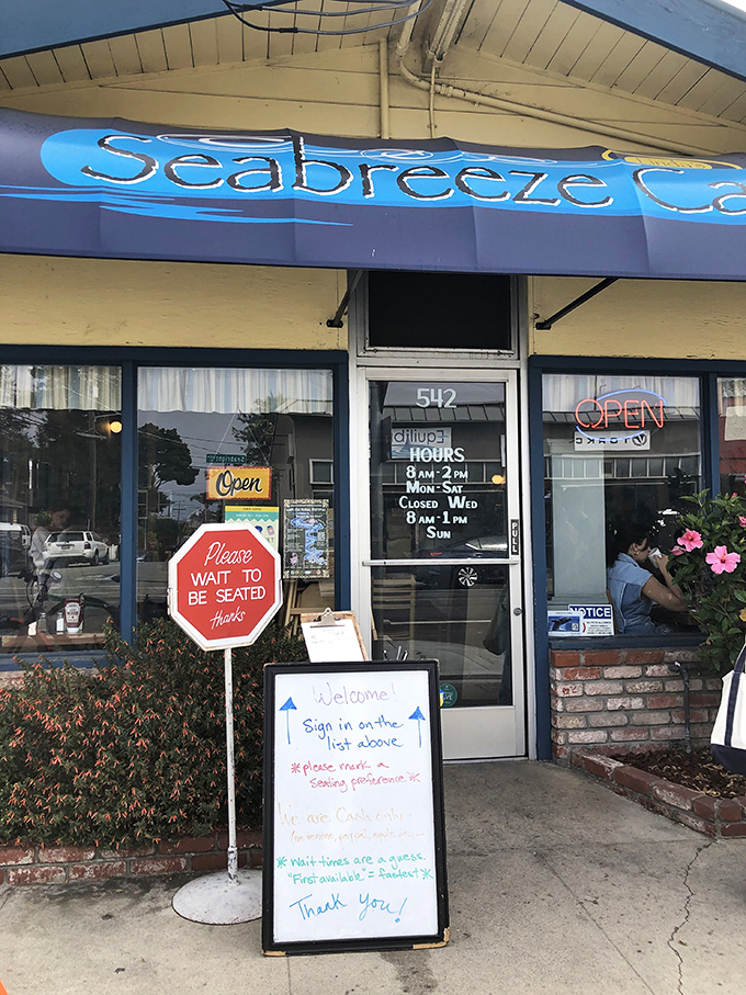The storefront sign that might as well say "Abandon all diets, ye who enter here"&mdash;with hours clearly posted for your breakfast planning needs.