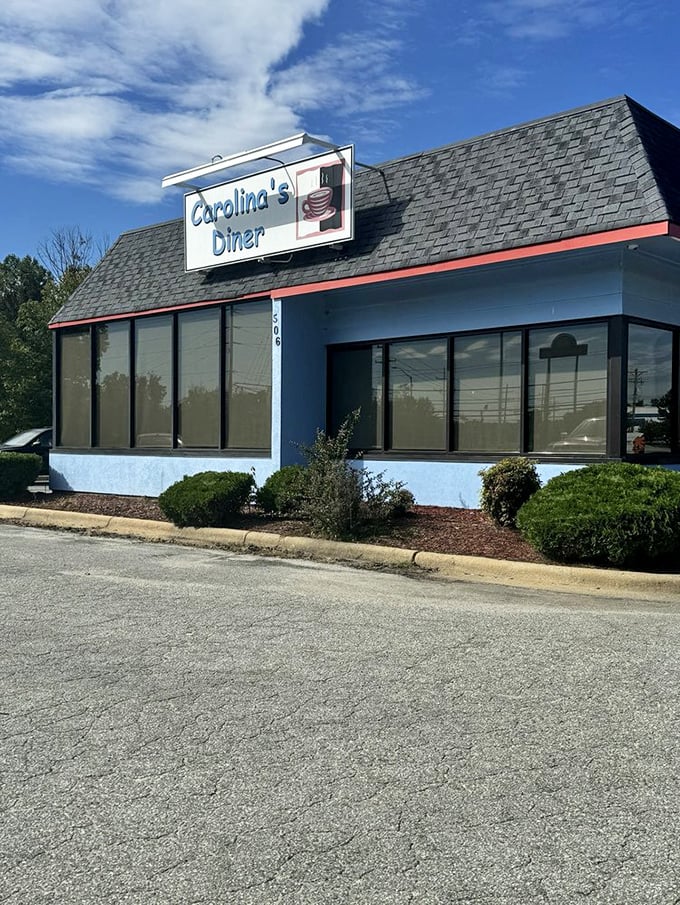 Carolina's Diner's blue exterior stands like a beacon of hope for hungry travelers &ndash; a roadside promise of honest food without pretension.