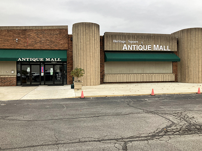 The exterior view of Heritage Square Antique Mall on a cloudy day—an unassuming storefront that houses a universe of vintage treasures.