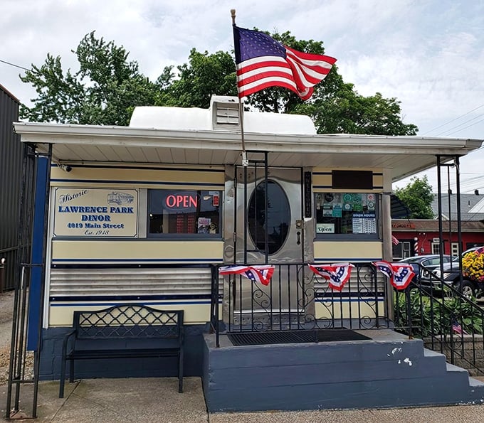 The historic storefront proudly displays its heritage&mdash;"Lawrence Park Dinor" with American flags adding a touch of hometown pride.