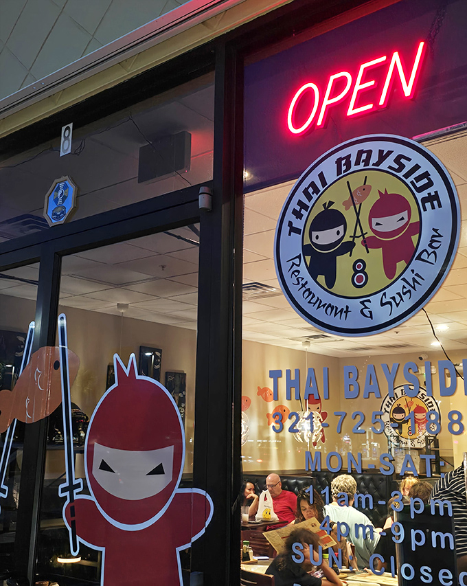 The glowing "OPEN" sign and ninja mascots&mdash;your signal that authentic Thai flavors await just beyond these doors.