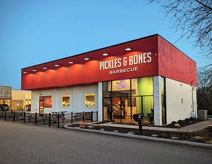 As dusk falls, Pickles & Bones transforms from daytime BBQ joint to evening meat sanctuary. The glow from within isn't just light&mdash;it's the promise of smoky satisfaction.