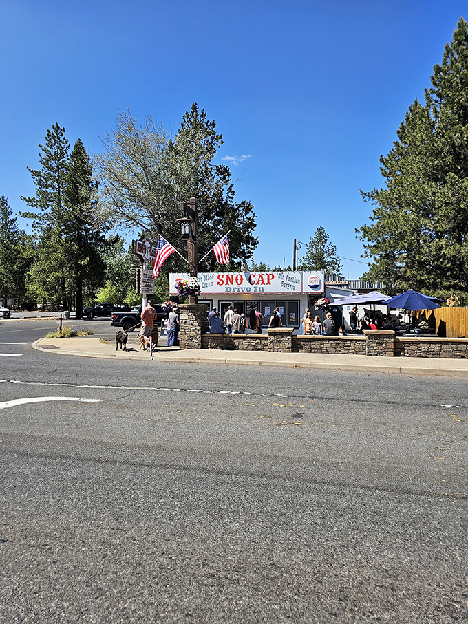 From this angle, you can almost smell the grilling burgers. The American flags add a touch of patriotism to this temple of classic roadside cuisine.