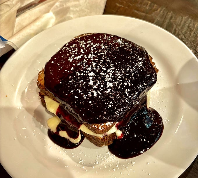 This isn't just dessert; it's a blueberry-soaked, cream-filled monument to why we should always save room for the finale.