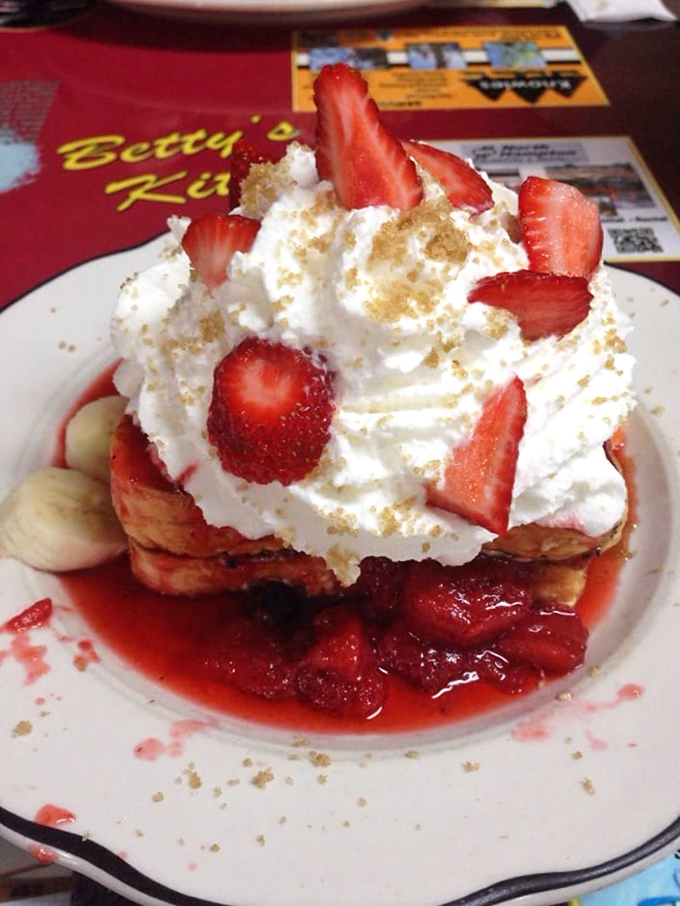 Stuffed French toast that makes ordinary breakfast seem like a missed opportunity. Those strawberries aren't garnish &ndash; they're ruby jewels in a crown of whipped cream.