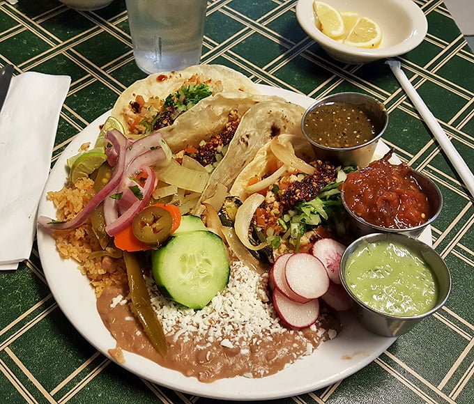 Taco Tuesday meets artistry with these colorful beauties. The condiment quartet standing at attention ensures every bite can be customized to perfection.