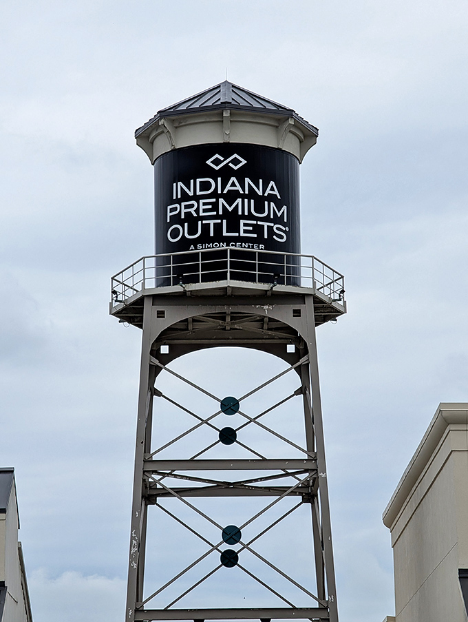 The iconic water tower stands as a retail lighthouse, guiding discount-seeking shoppers safely to harbor at Indiana Premium Outlets.
