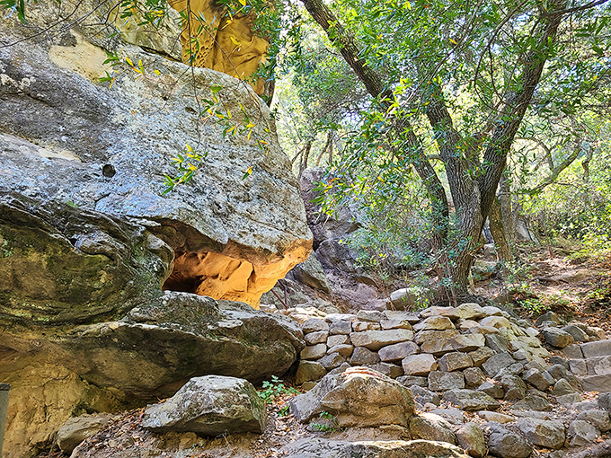 Stone steps guide visitors along the approach to this sacred space, where California oak trees provide the same dappled shade they offered centuries ago.