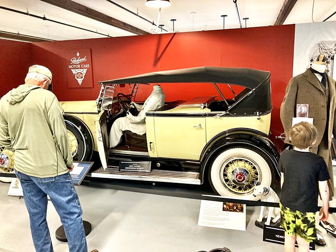 This cream-colored Packard represents an era when cars weren't just transportation but rolling sculptures, commanding attention with every gleaming curve and chrome detail.