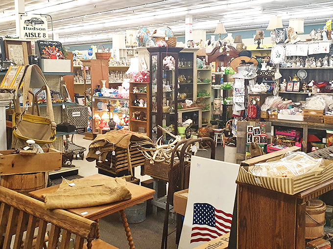 The "Hudson Aisle 8" sign marks a neighborhood of nostalgia where furniture from three generations ago waits for its comeback tour.