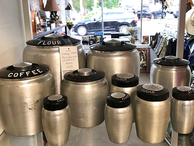 Grandma's kitchen canisters stand at attention, ready for flour-dusted adventures. These aluminum soldiers have weathered decades of midnight cookie missions.