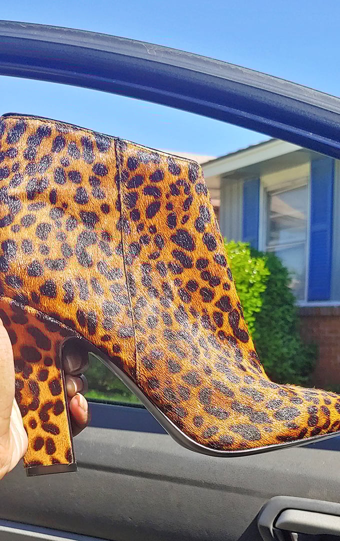 Leopard print booties that scream "confidence" without shouting "I paid full price"&mdash;the ultimate secondhand shopping victory.