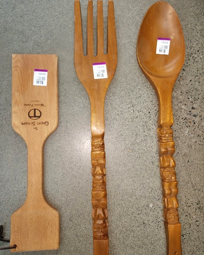 Giant wooden utensils that blur the line between kitchen tools and wall art—perfect for serving salad or starting conversations.