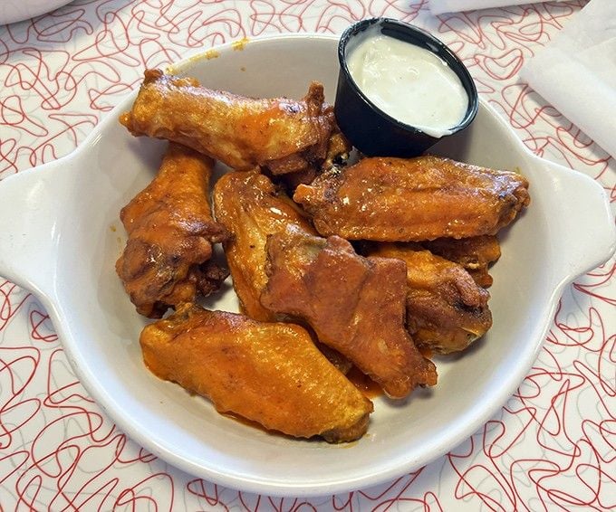 Golden chicken wings glazed to perfection arrive ready to convert anyone who thinks wings are only for game day.