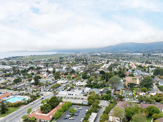 Small-town charm survives along tree-lined streets where locals still know their neighbors in this authentic beach community.