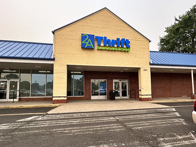 The bright blue and yellow facade of 2nd Ave Thrift Superstore stands like a beacon of bargain hope for treasure hunters everywhere.