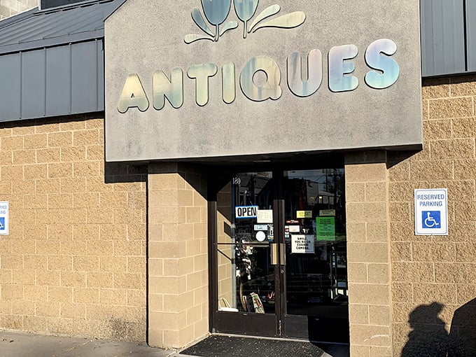 The gleaming "ANTIQUES" sign beckons like a portal to treasures waiting to be discovered inside Abby's.