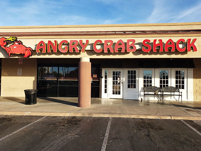 The Angry Crab Shack's bright red sign promises seafood with attitude. Get ready to roll up your sleeves and dive into flavor!