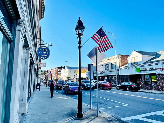 Athol's Main Street welcomes you with classic New England charm &ndash; lamp posts, flags, and small-town bustle that feels like coming home.