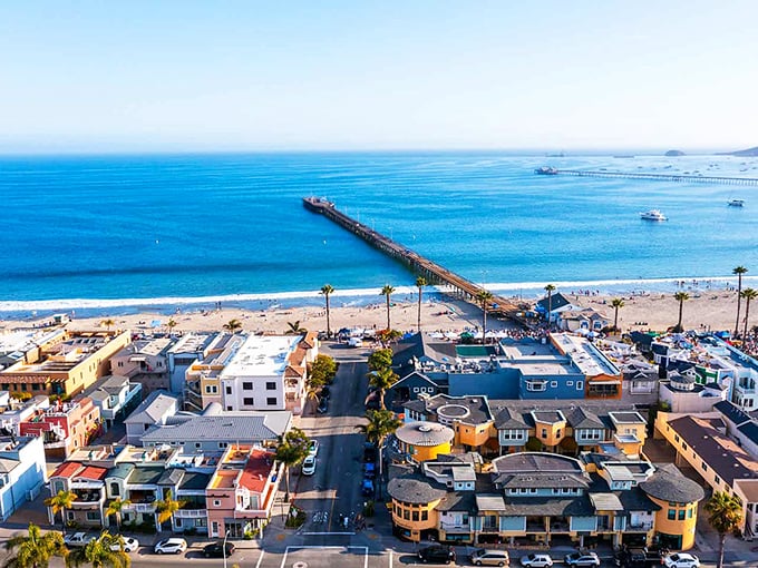 That blue water and colorful buildings create a scene that looks almost too perfect to be real.