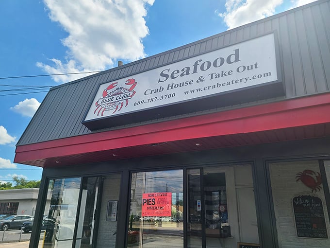 Crab paradise alert! This no-frills seafood haven promises ocean-fresh delights behind that unassuming storefront. The red trim practically screams "delicious crustaceans inside!"