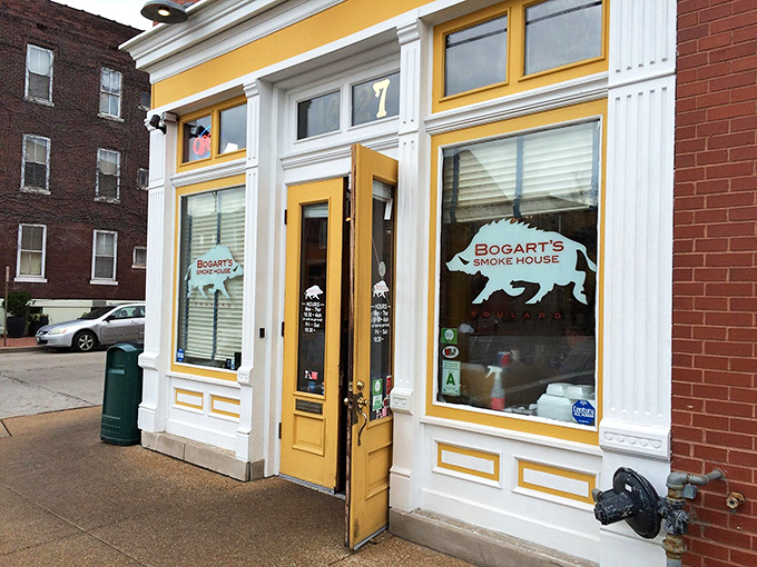 The bright yellow storefront of Bogart's Smokehouse beckons like a barbecue lighthouse, guiding hungry souls to smoky salvation.