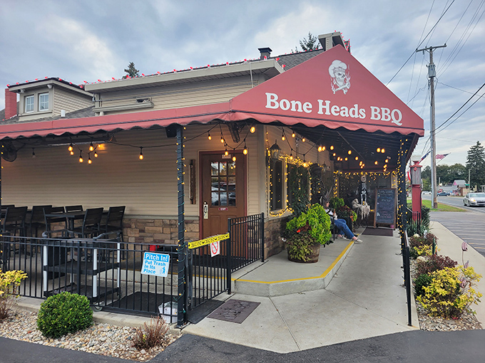 String lights and red awnings create the perfect "come on in" vibe at this Willis barbecue haven.