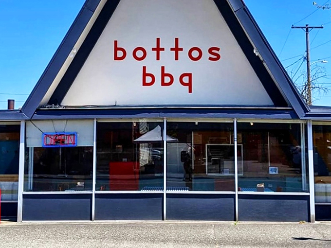 The iconic A-frame of Botto's BBQ stands like a temple to smoked meat. Simple red lettering promises no-nonsense barbecue inside.