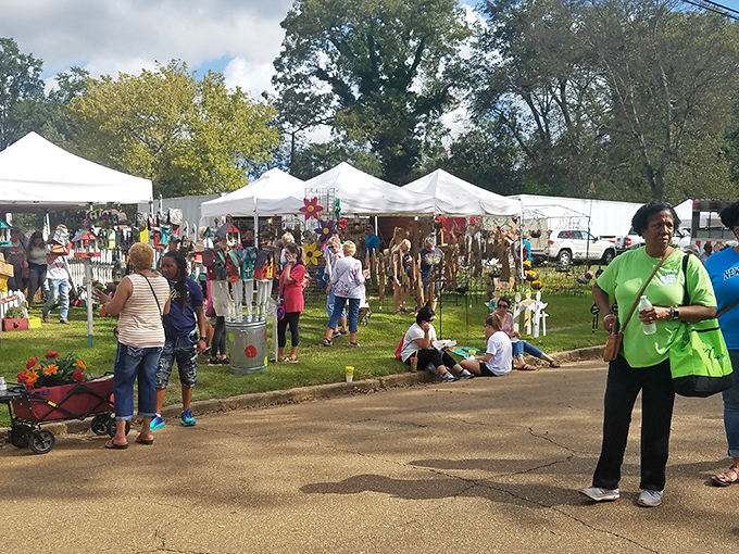 Canton Flea Market buzzes with treasure hunters exploring white tents filled with endless possibilities and surprises.